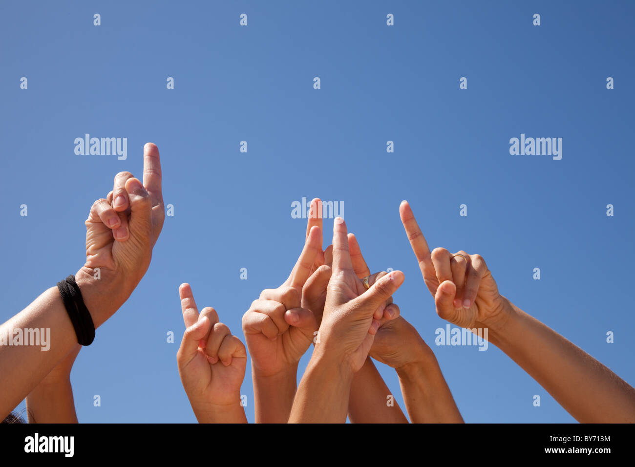 Many hands reaching up hi-res stock photography and images - Alamy