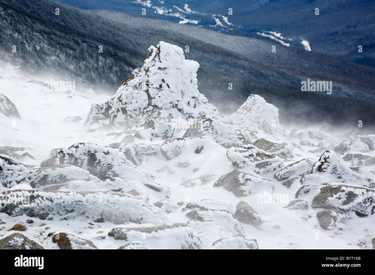 Strong winds blow snow across the open ridge of Mount Lafayette along ...