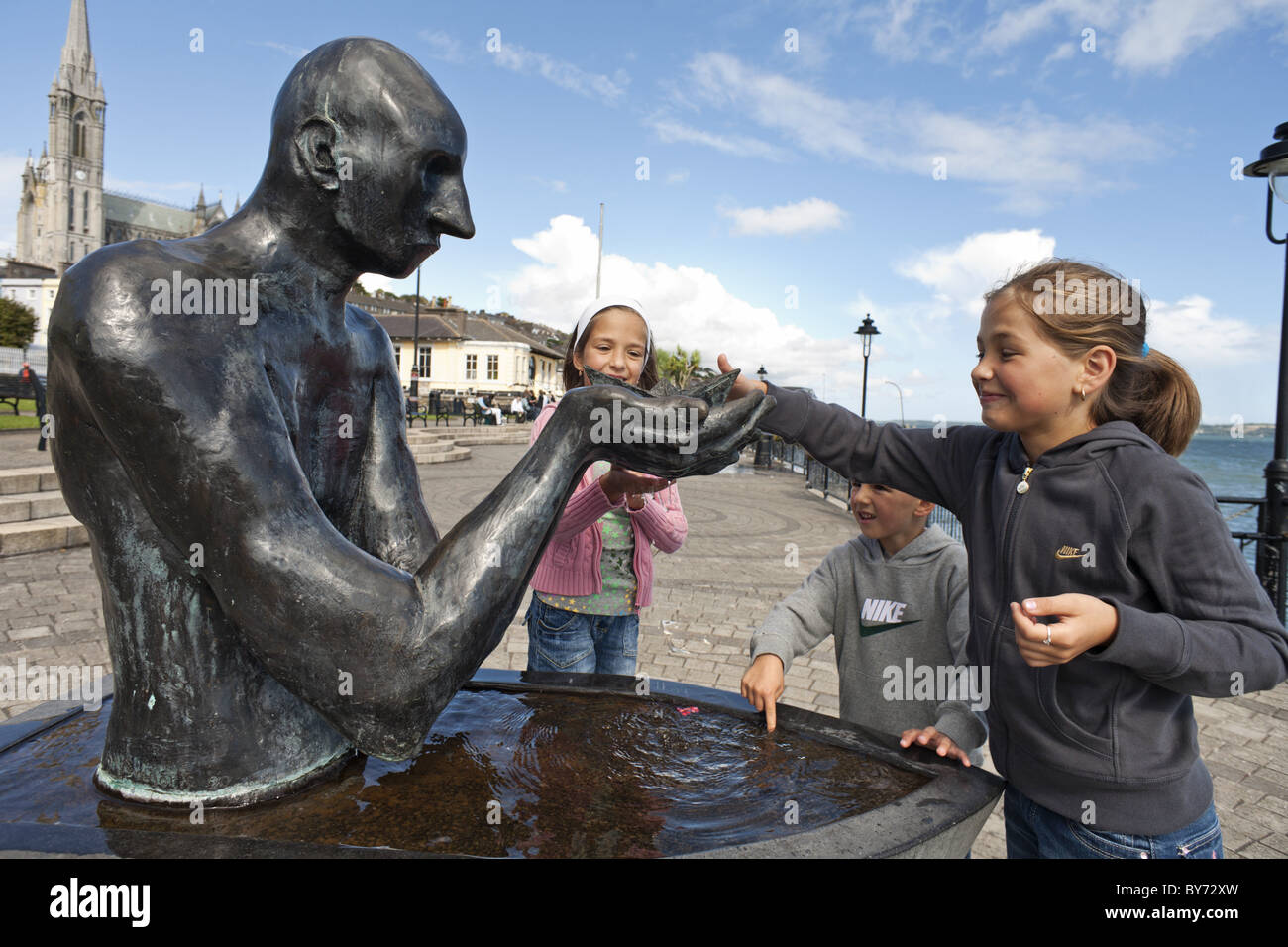 Children playing by a fountain, Cobh, County Cork, Ireland Stock Photo ...
