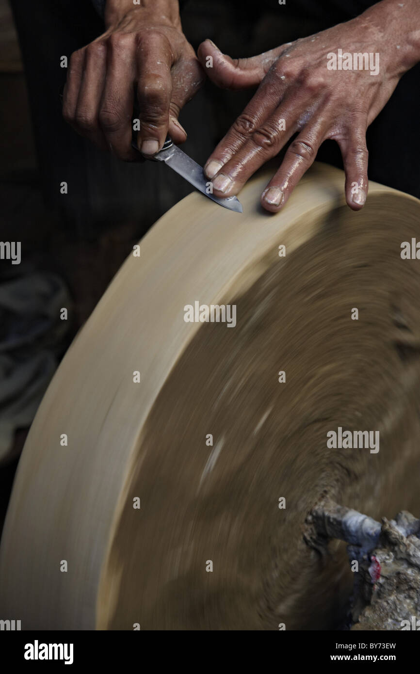 Hands holding knife at grindstone, Fes, Morocco, Africa Stock Photo - Alamy