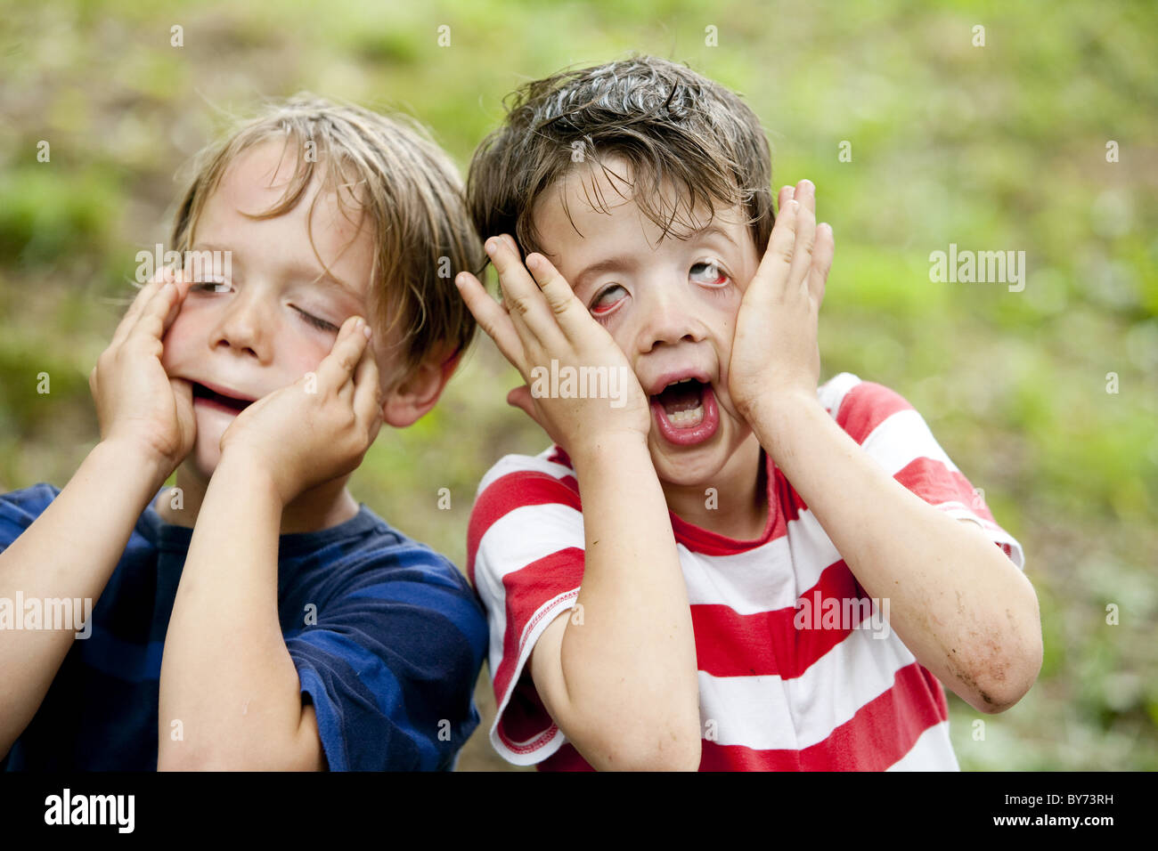 Two boys (6 - 7 years) grimacing Stock Photo - Alamy