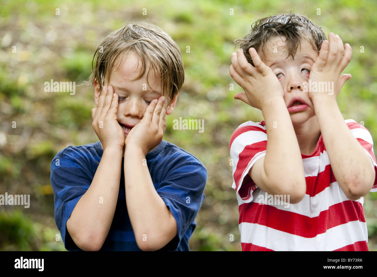 Two boys (6 - 7 years) grimacing Stock Photo - Alamy