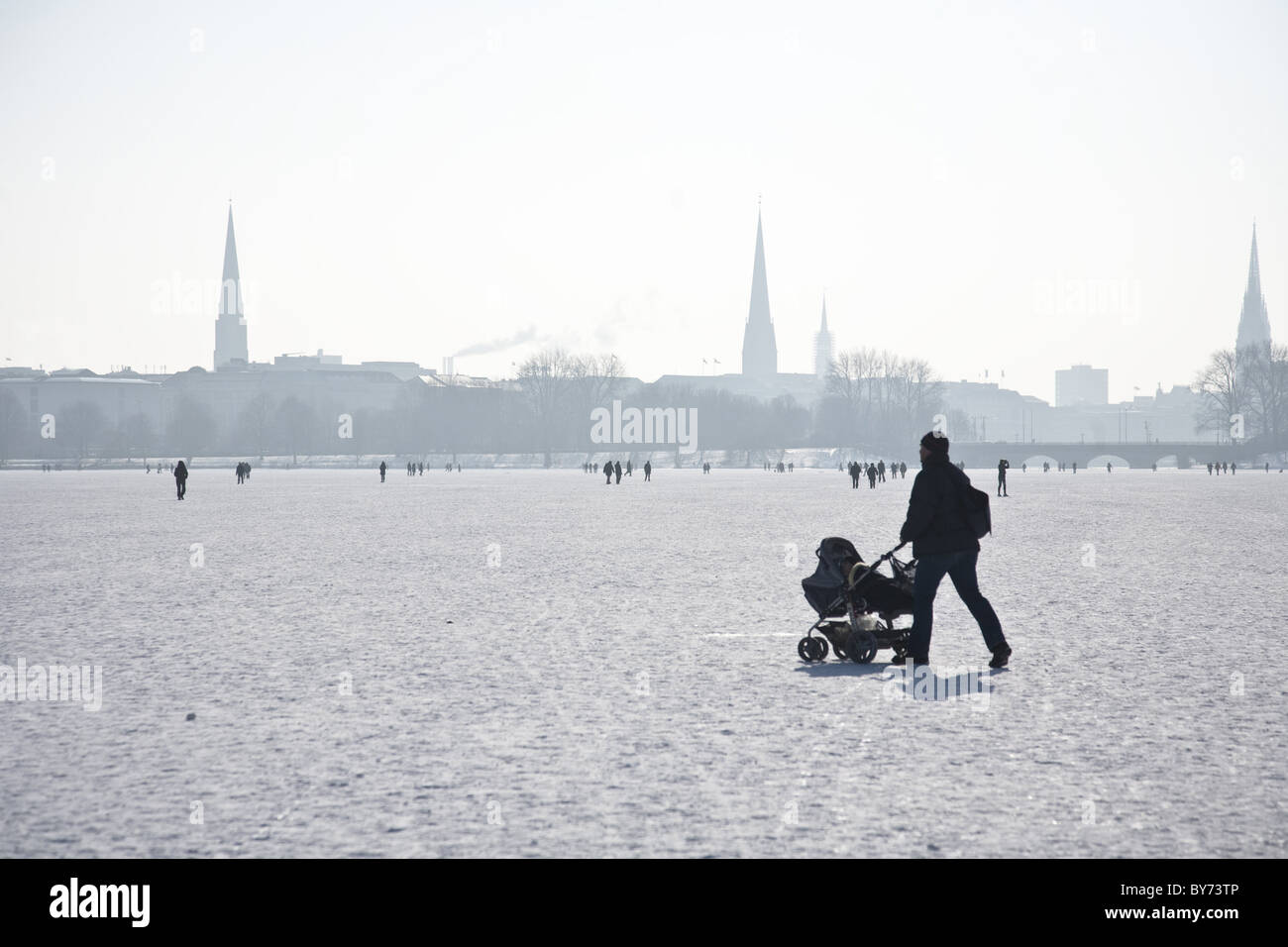 Stroller with buggy on frozen outer Alster in winter, Hamburg, Germany ...
