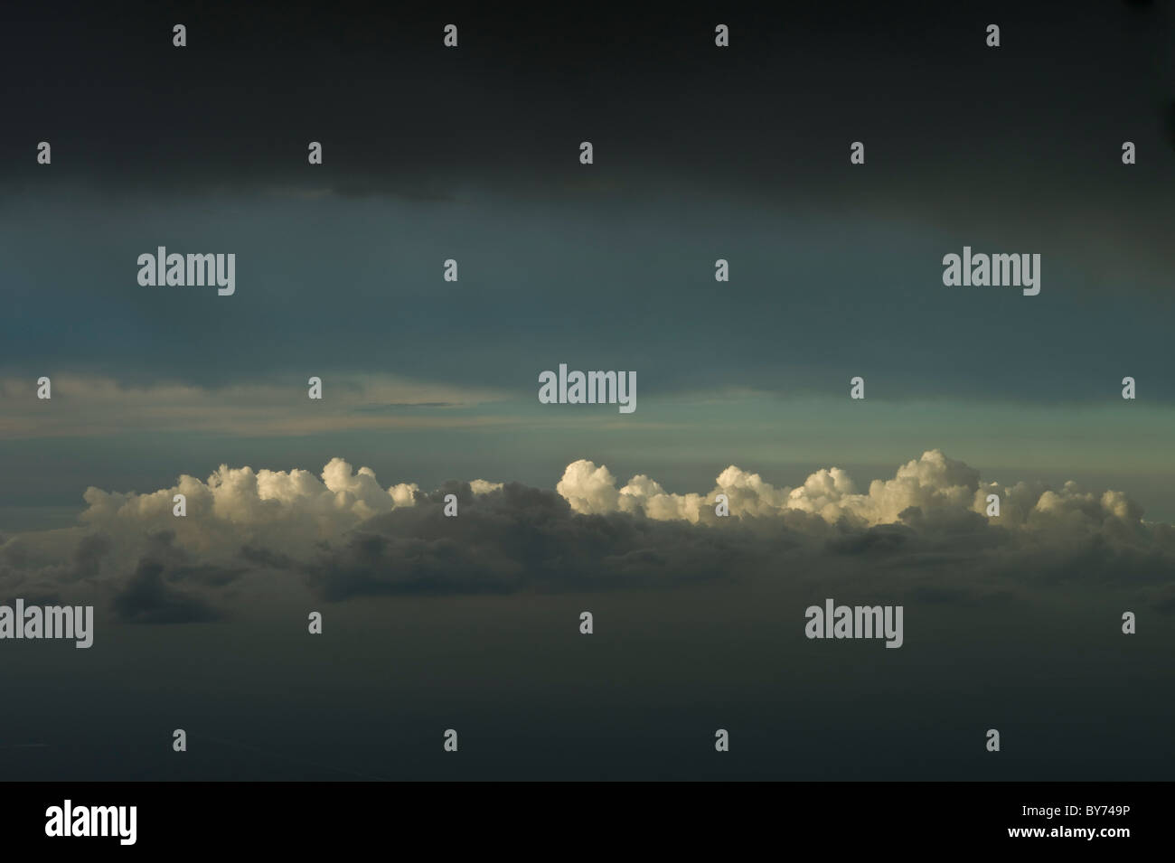 Clouds out of airliners window Stock Photo - Alamy