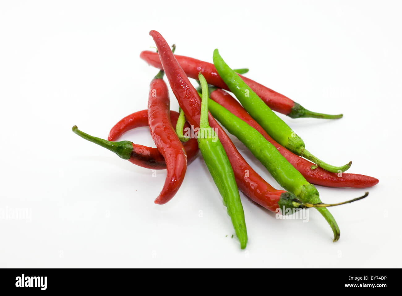 isolated chili stack on the white background Stock Photo - Alamy