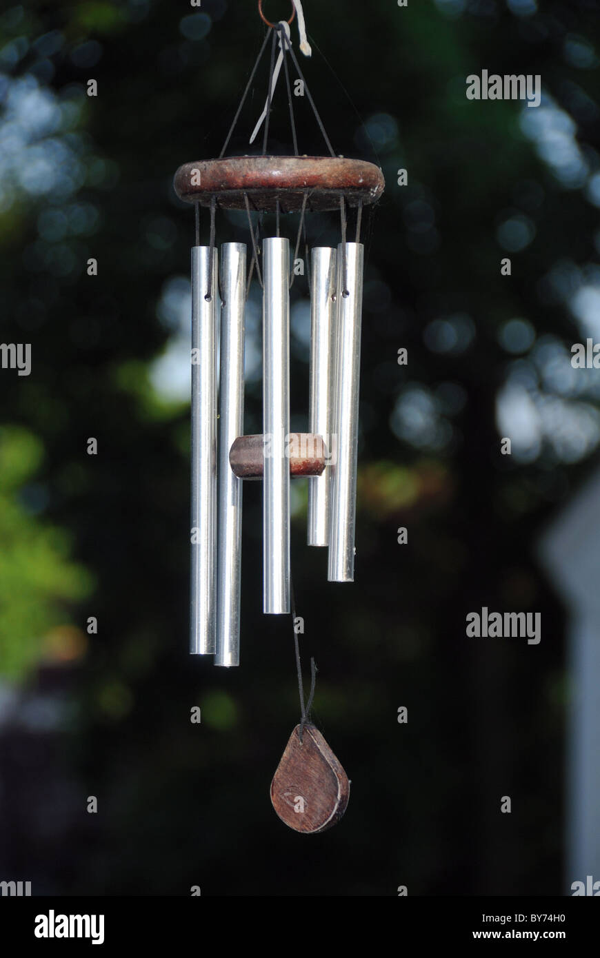 A Wind chime isolated against a natural background Stock Photo - Alamy