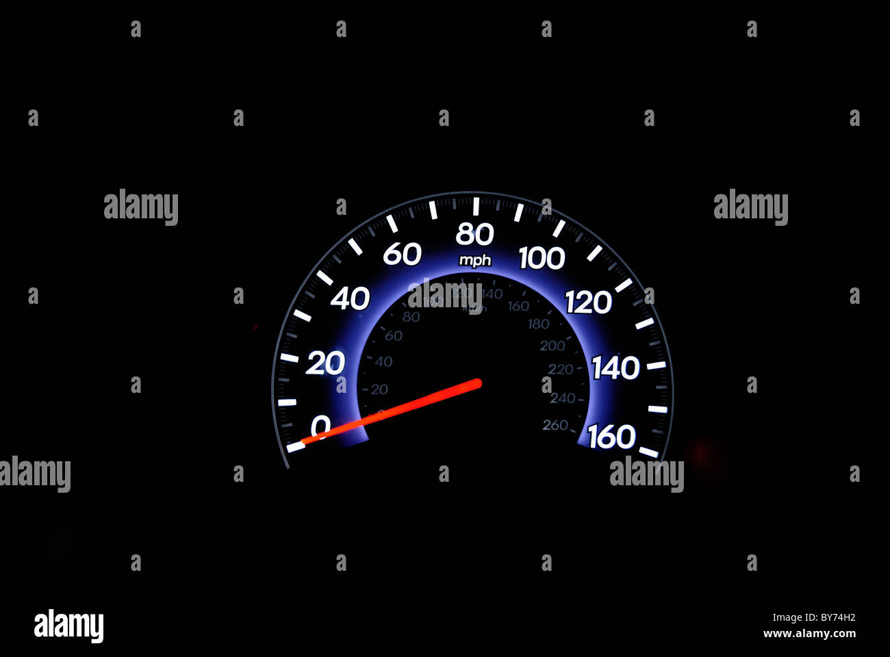 An odometer isolated against a dark background Stock Photo - Alamy
