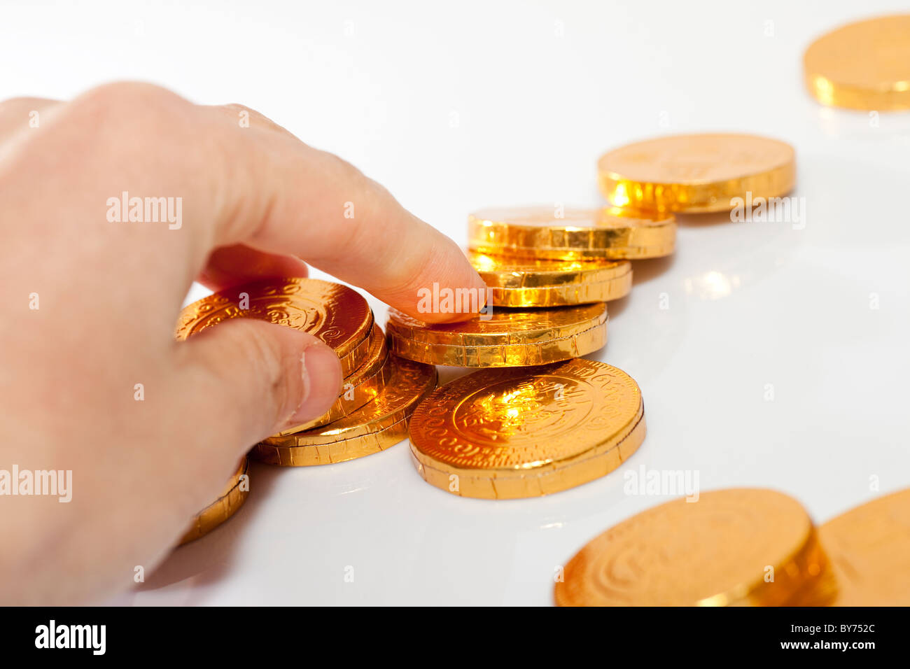 Stack of chocolate coins hi-res stock photography and images - Alamy