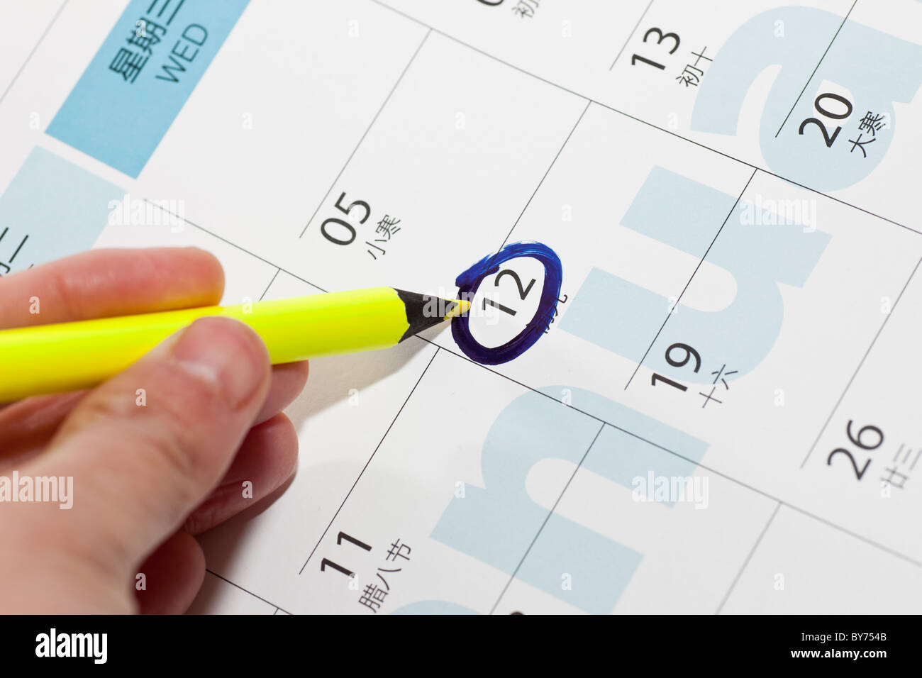 pen pointing the date of a Calendar Stock Photo - Alamy