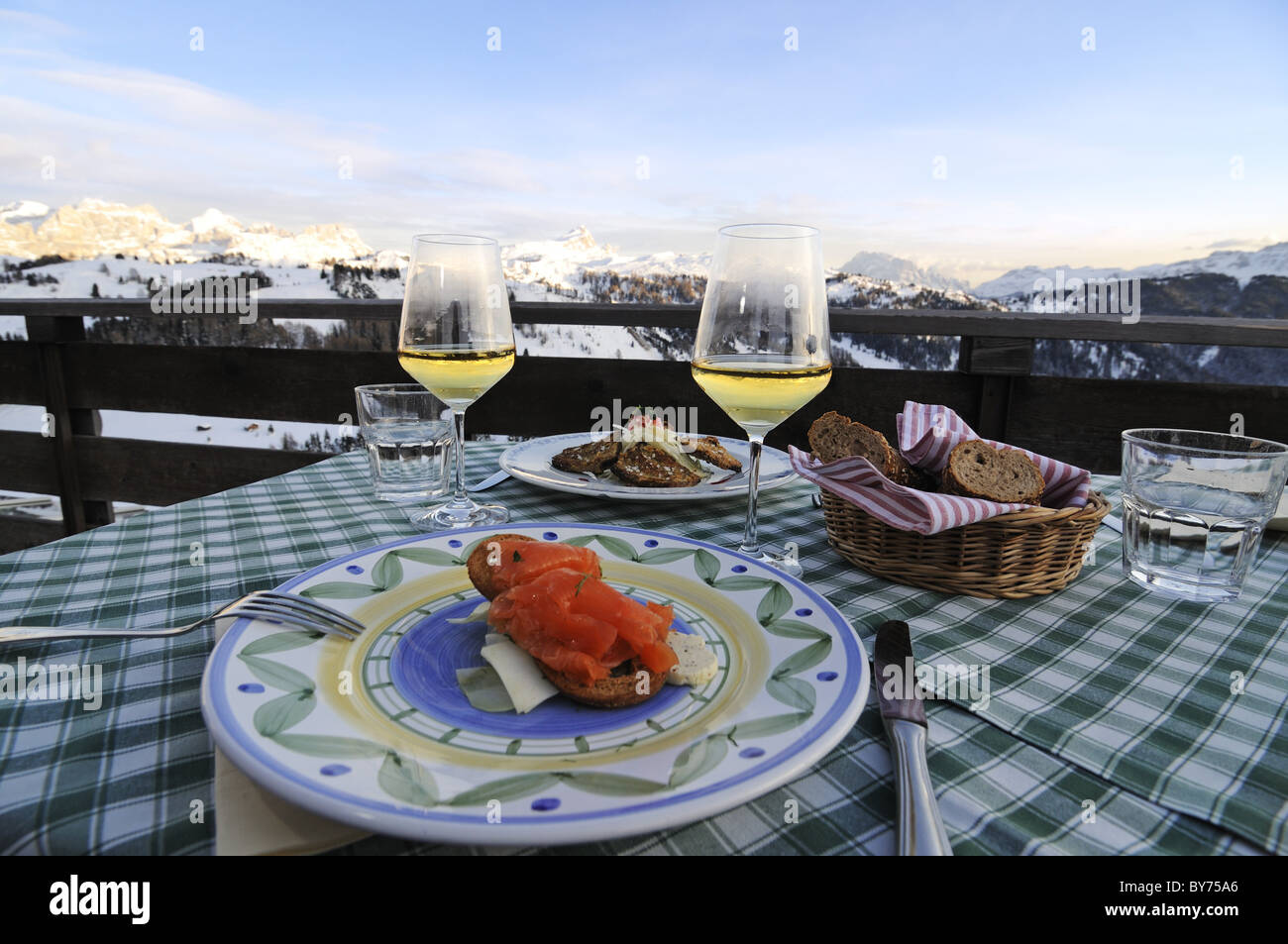 A table is laid on a balcony in front of Sella group, Hotel Col Alt ...