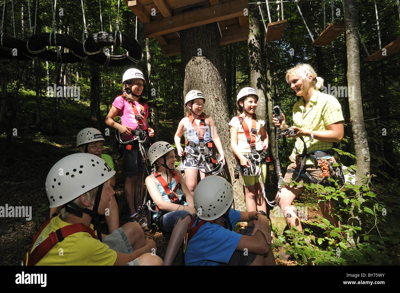 Children and woman at high ropes course at Maserer Pass, Reit im Winkl ...