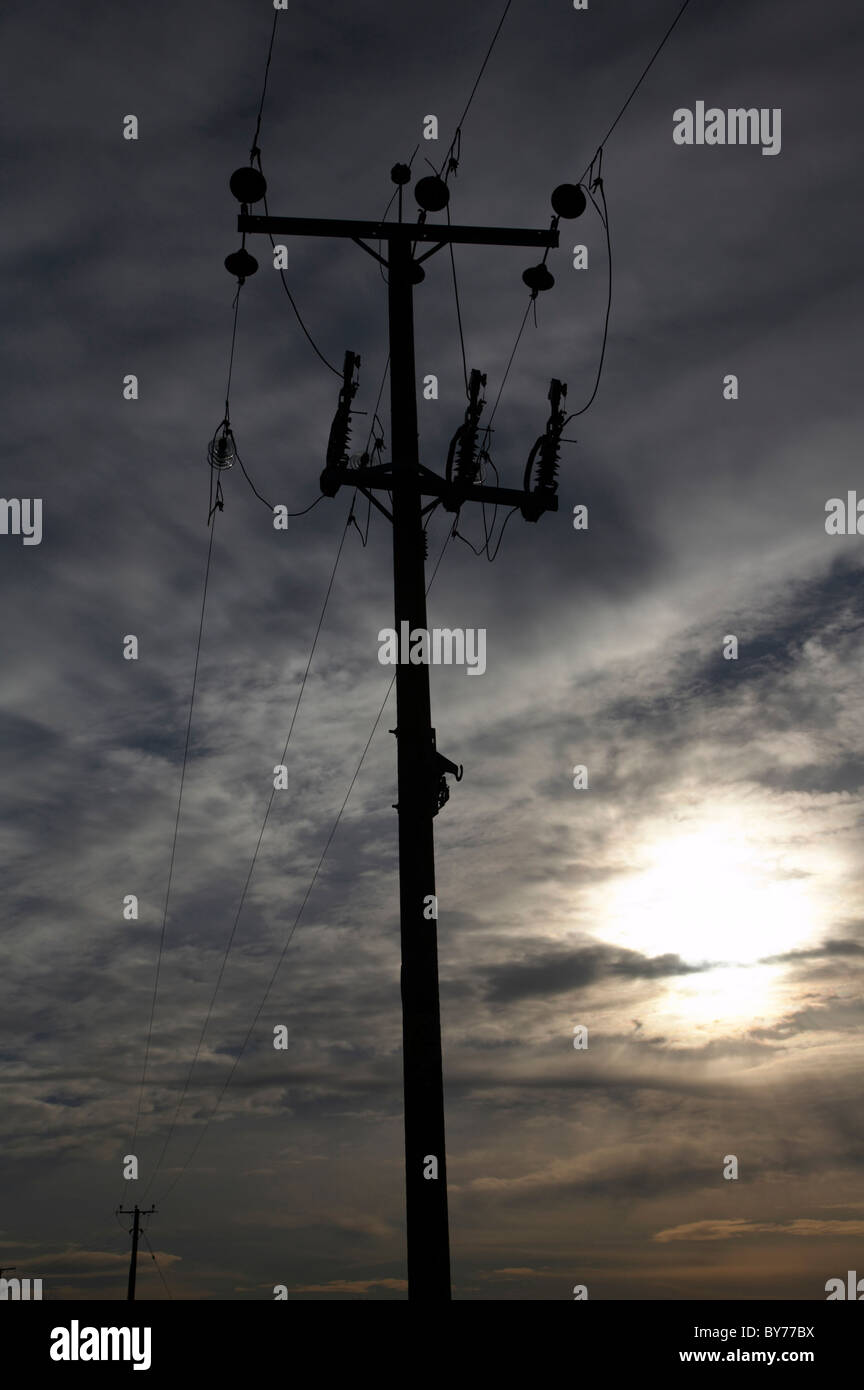 High voltage pole in dramatic sky Stock Photo - Alamy