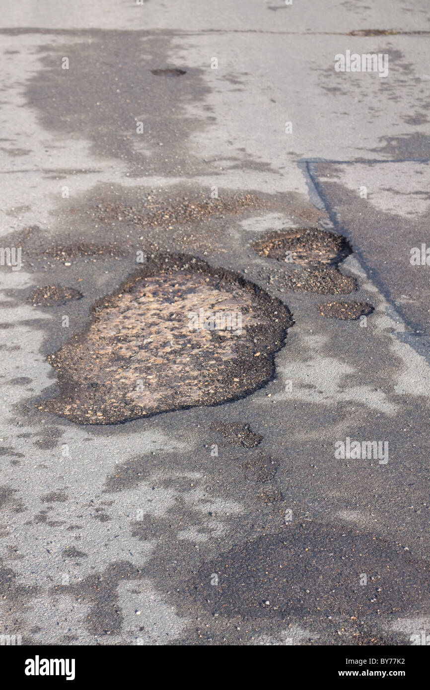 Potholes in the road Stock Photo - Alamy
