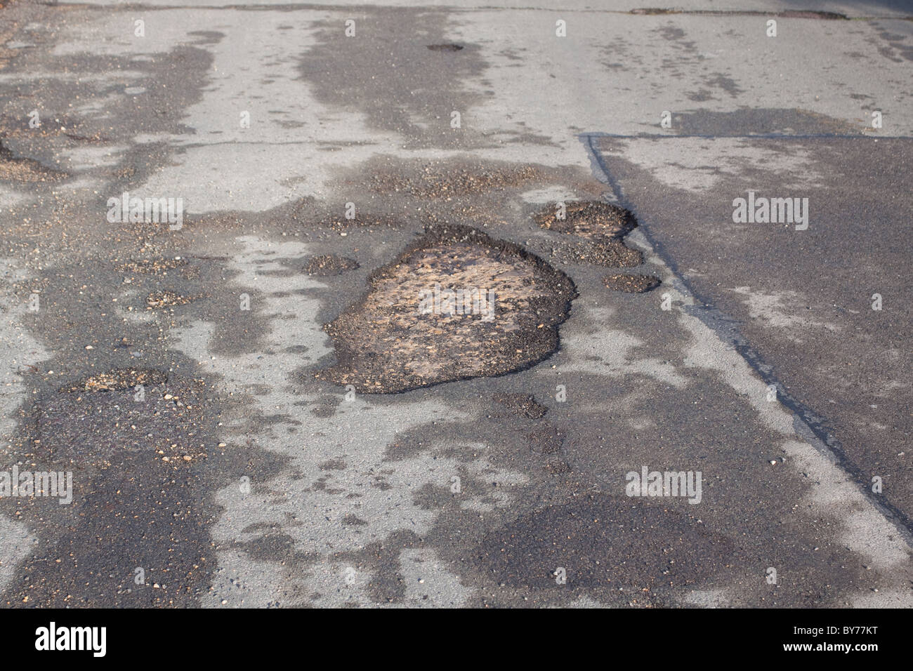 Potholes in the road Stock Photo - Alamy