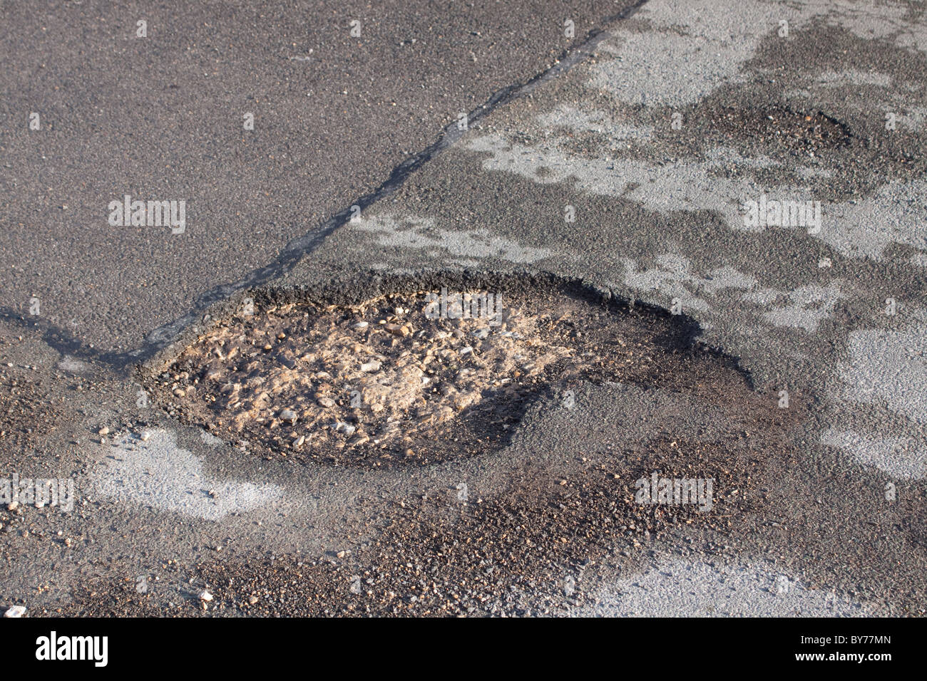 Potholes in the road Stock Photo - Alamy