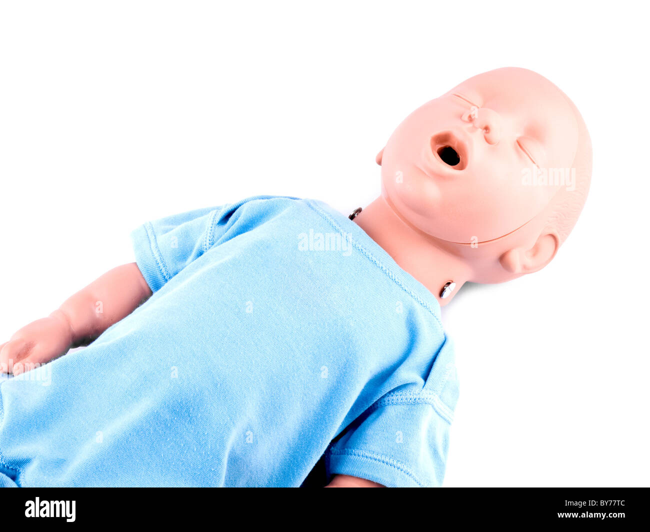 First aid training infant dummy on white background Stock Photo - Alamy