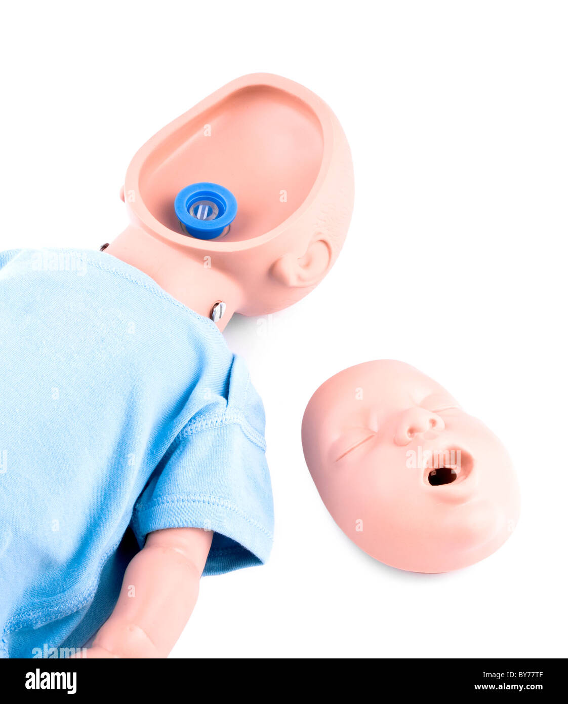 First aid training infant dummy on white background Stock Photo - Alamy