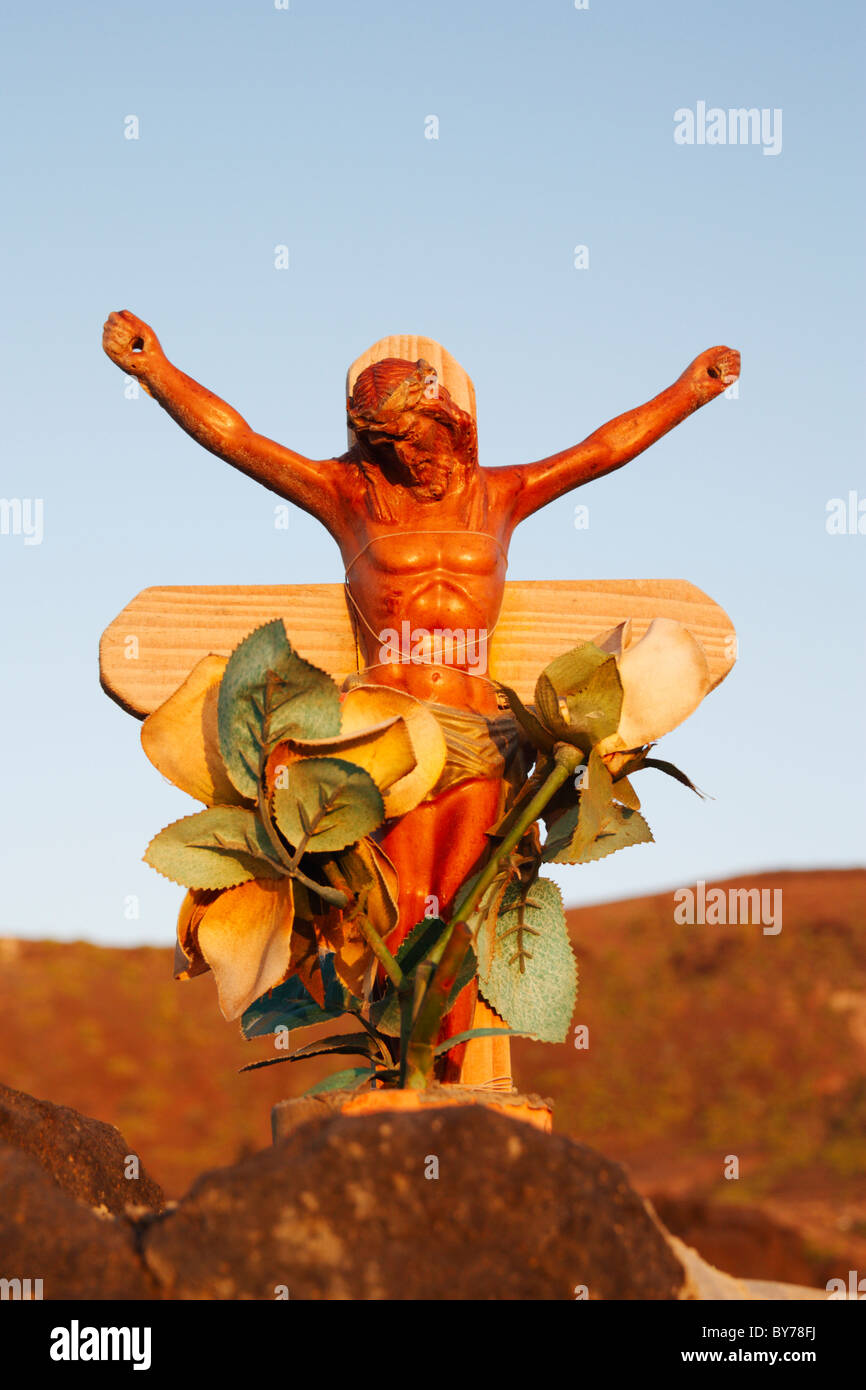 Jesus on wooden cross on makeshift grave on beach in Spain Stock Photo ...