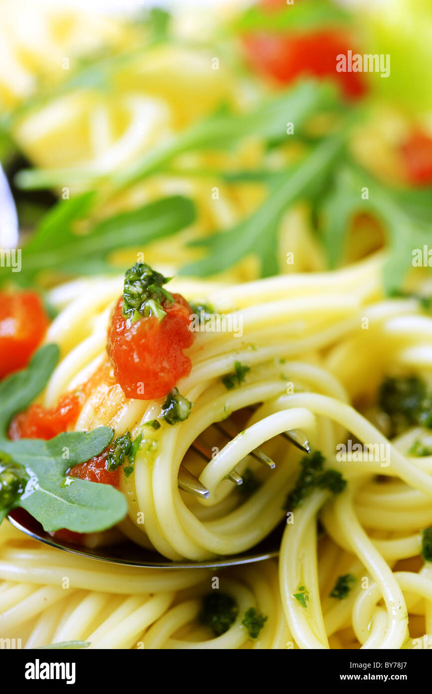 Macro shot of spaghetti twirled around a fork Stock Photo - Alamy