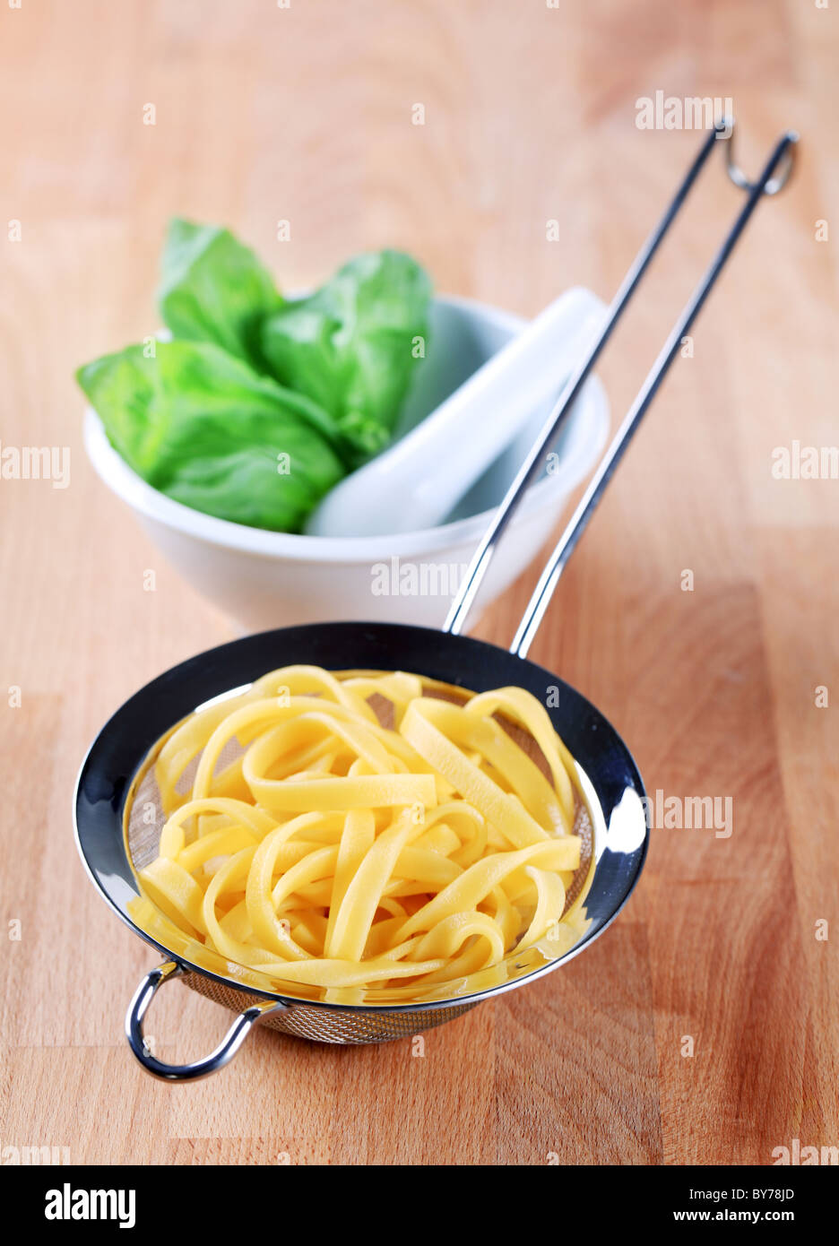 Cooked ribbon pasta in a metal sieve Stock Photo - Alamy