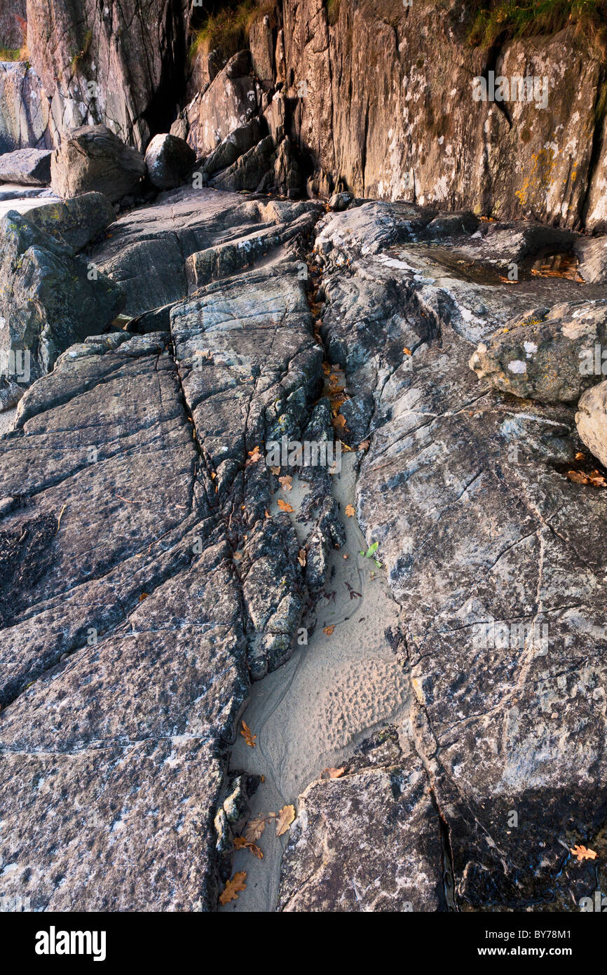 Low tide revealing weathered rock Stock Photo - Alamy
