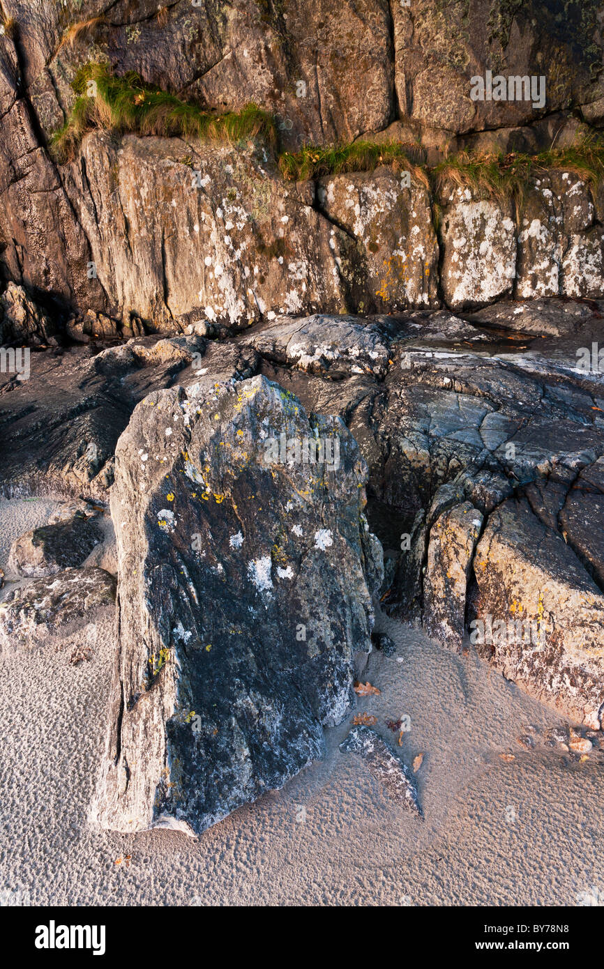 Low tide revealing weathered rock Stock Photo - Alamy