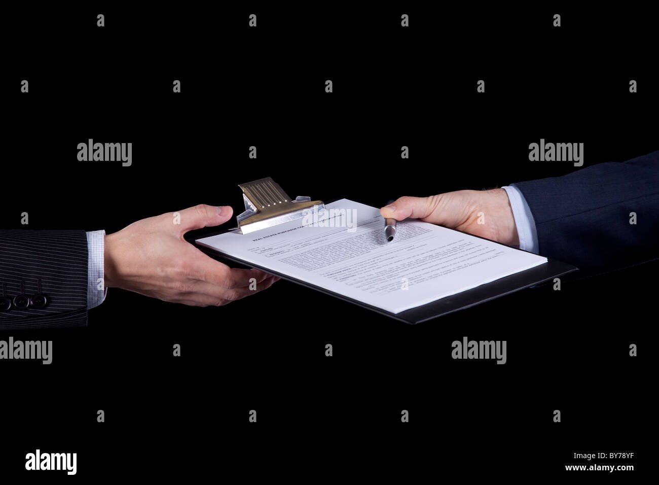 hands of two businessman passing some contract Stock Photo - Alamy