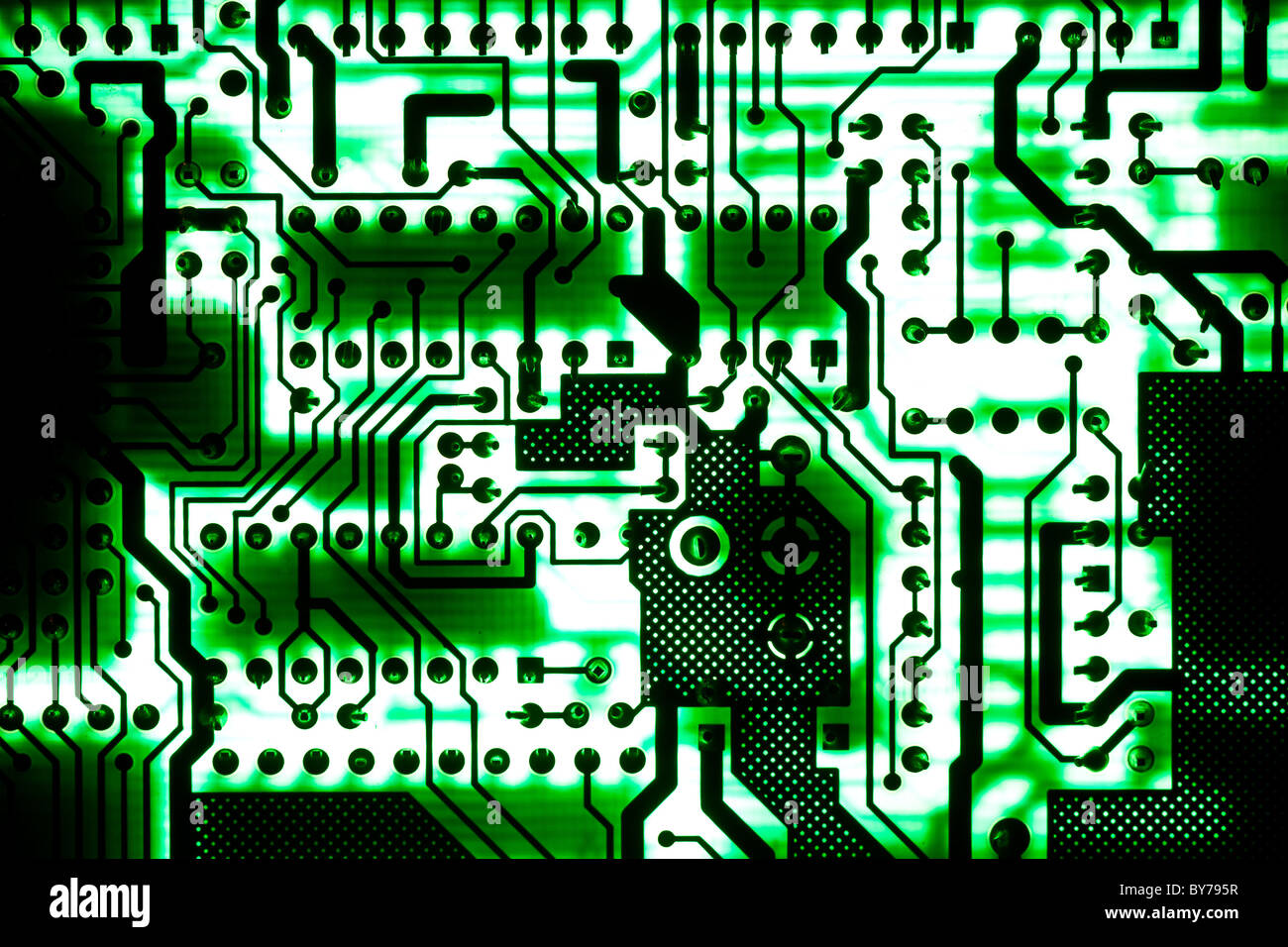 backlit printed circuit board filled with electronic stuff Stock Photo ...