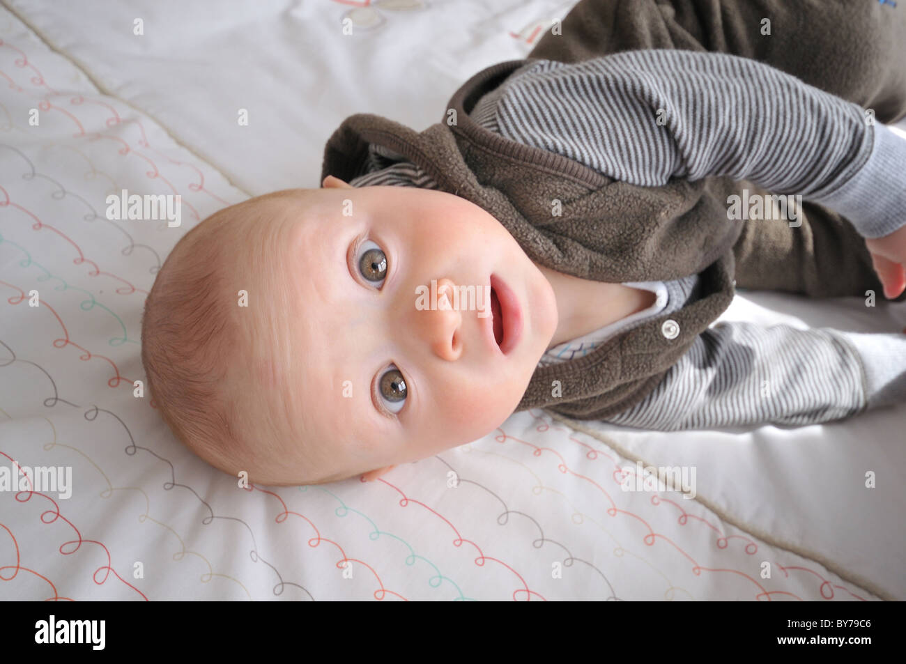 Cute baby with big eyes looking directly at camera Stock Photo - Alamy