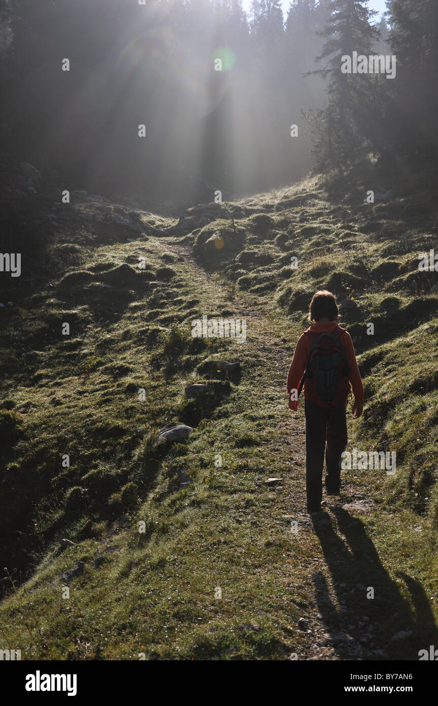 young boy walking Stock Photo - Alamy