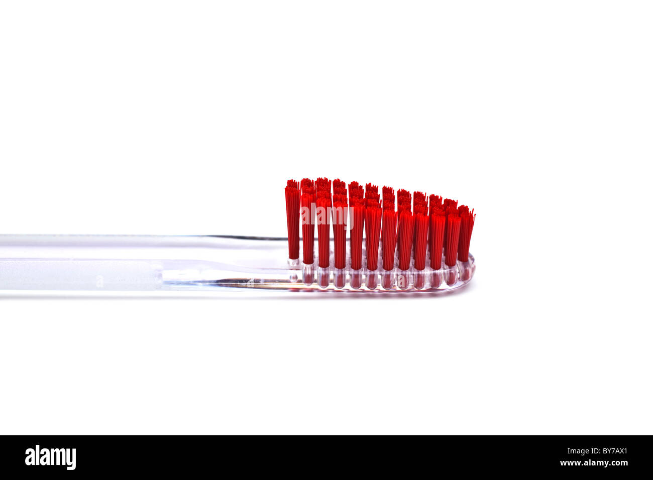 red toothbrush isolated on white background Stock Photo - Alamy