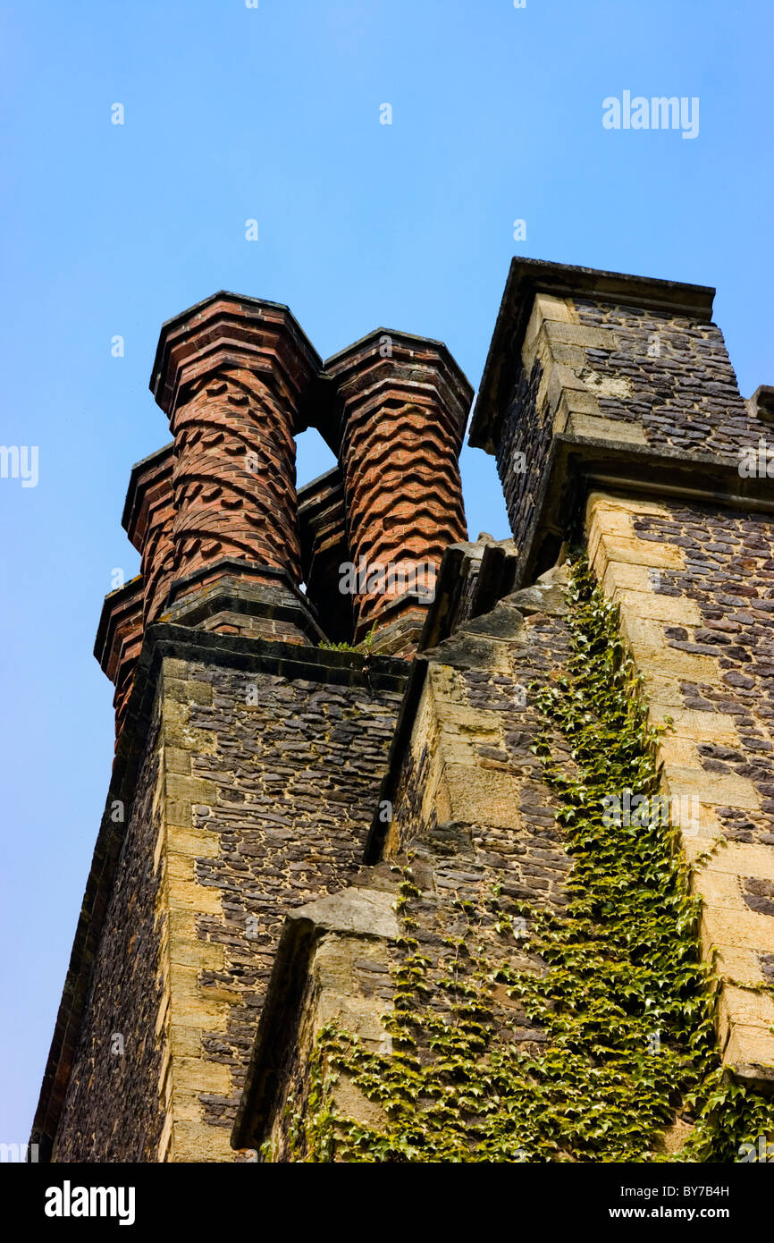 Tall ornamental brick chimneys on old English mansion Stock Photo - Alamy