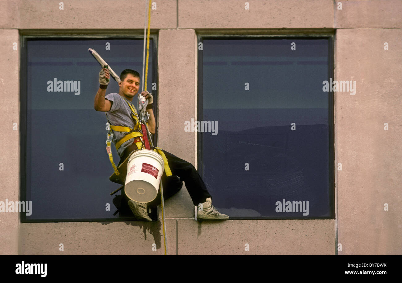 Man washing building windows Stock Photo - Alamy
