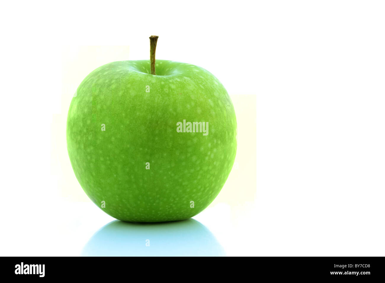 Single green apple with a reflection on a white background Stock Photo ...