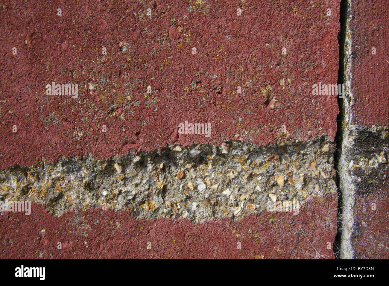 detail of concrete wall painted red with split and scar Stock Photo - Alamy
