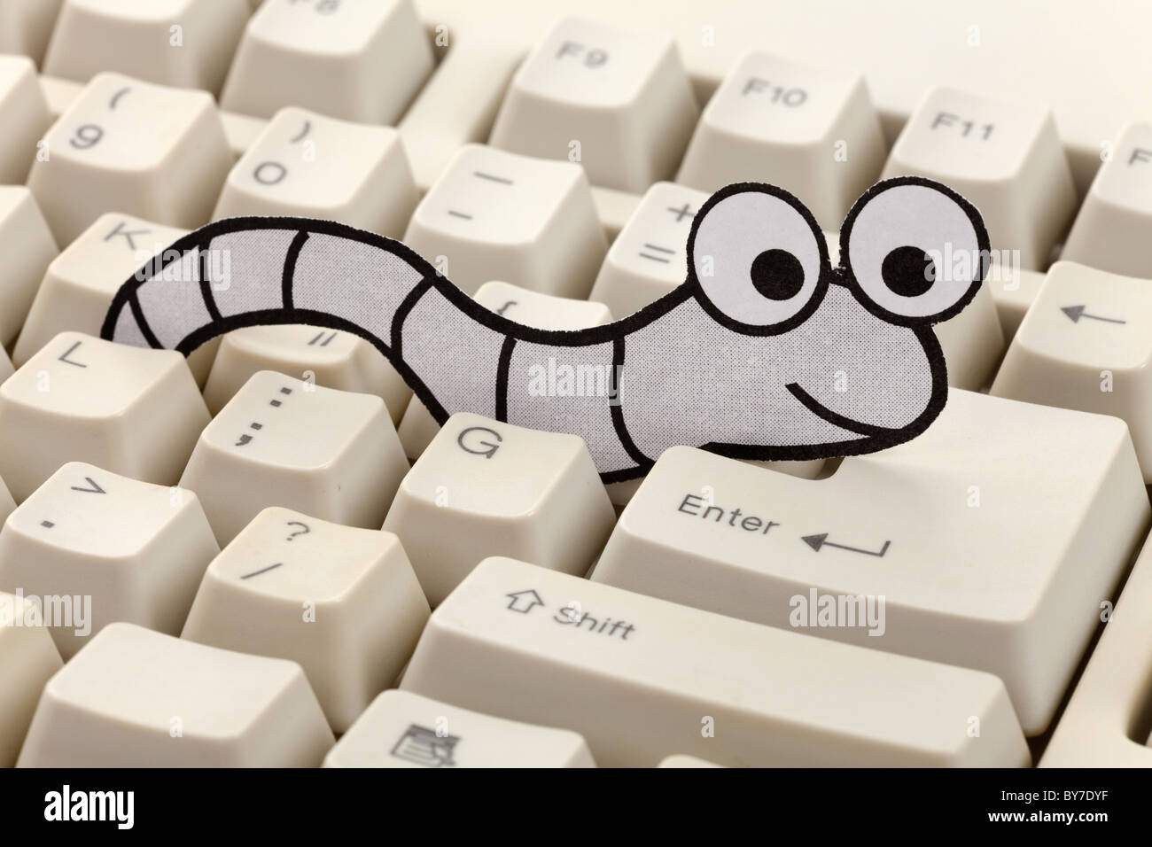 Worm and computer keyboard, concept of Security, Virus Stock Photo - Alamy