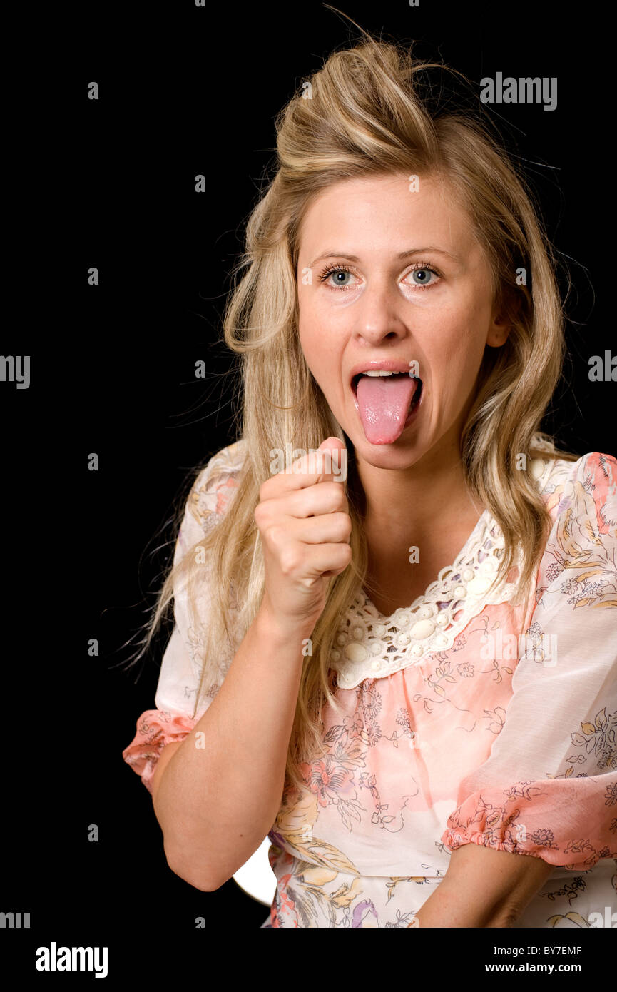 women with tong out Stock Photo - Alamy
