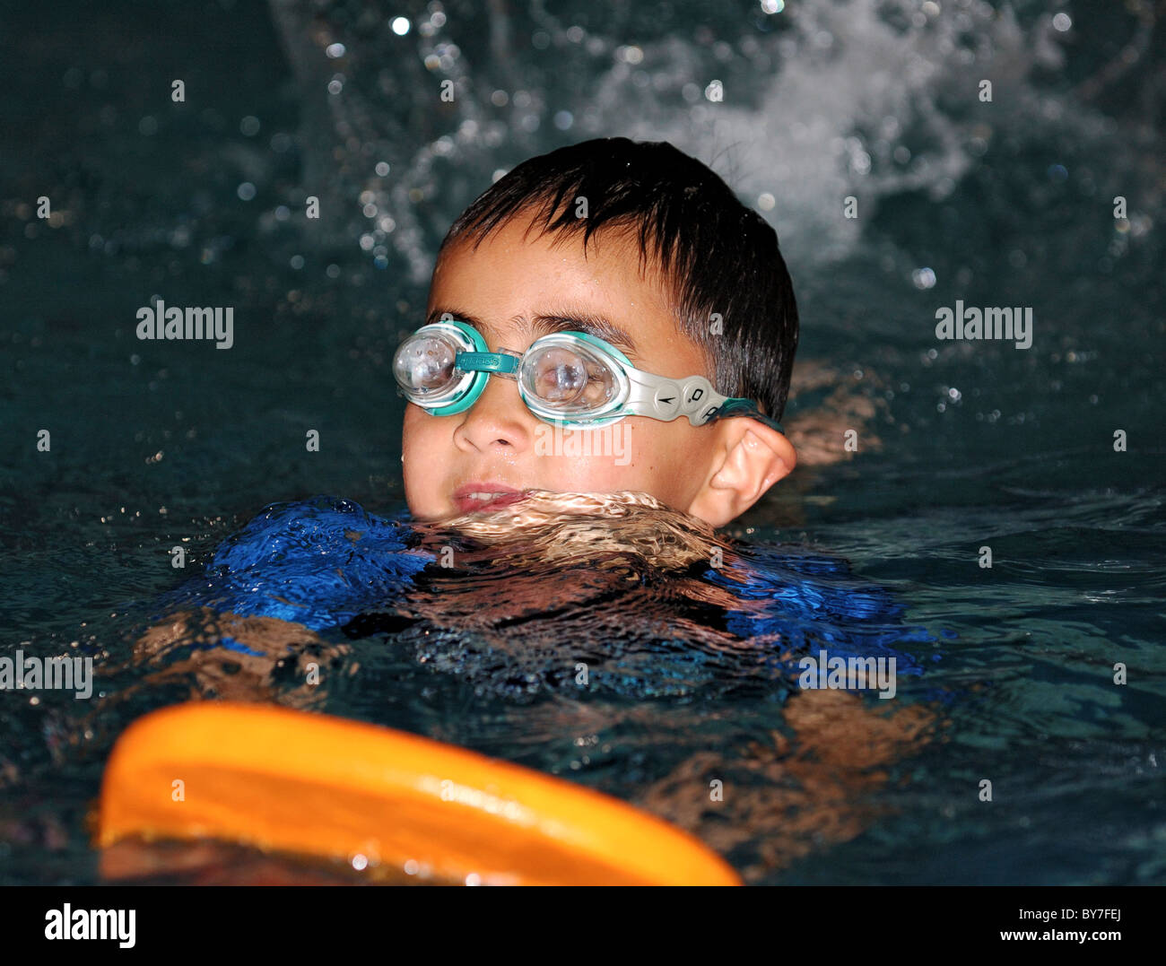 Little boy learning to swim Stock Photo - Alamy