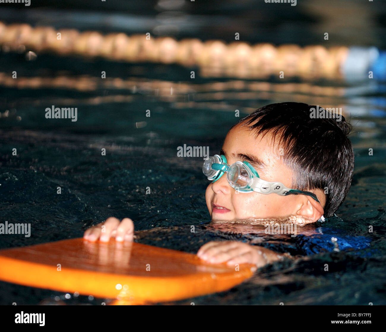 Little boy learning to swim Stock Photo - Alamy