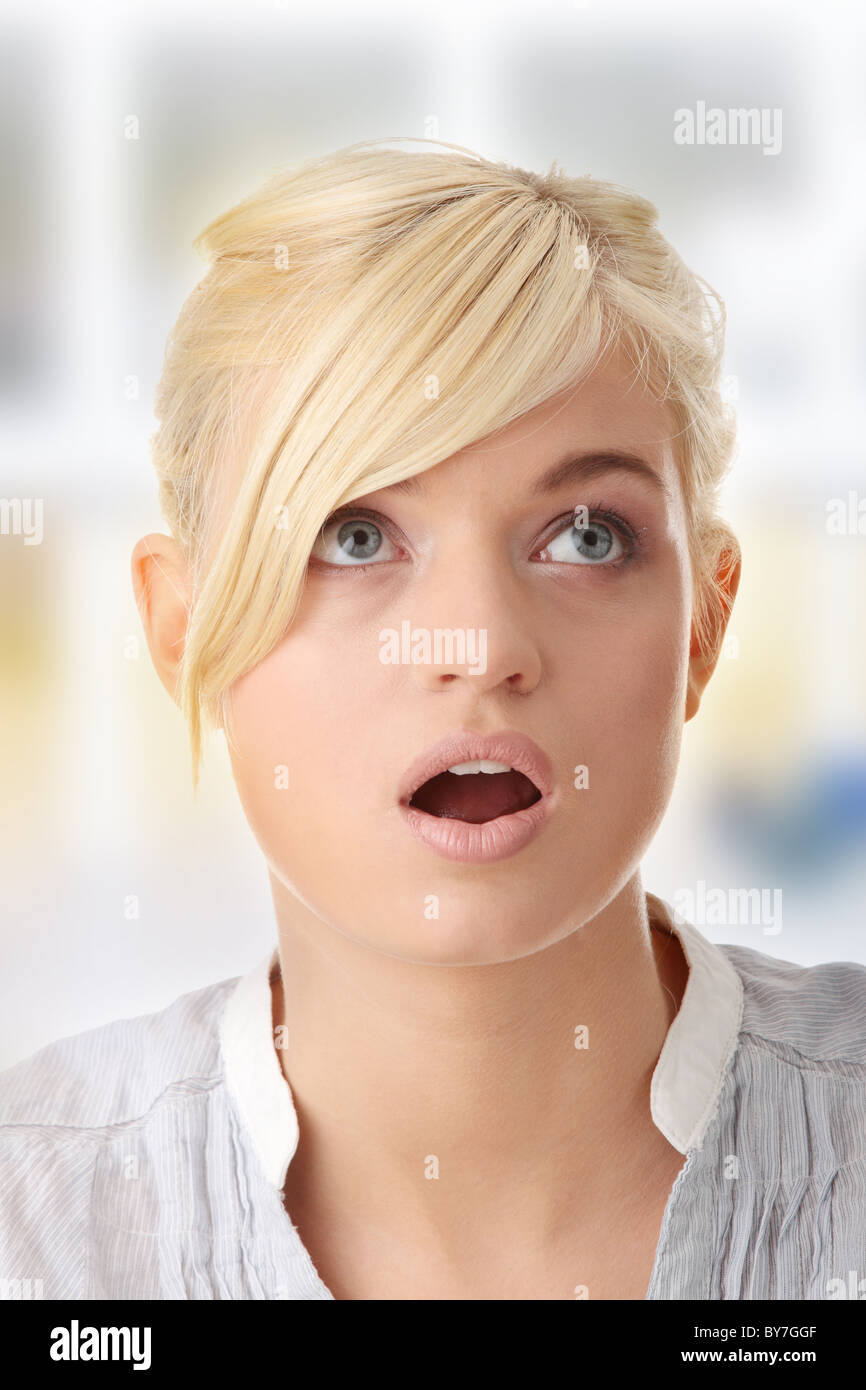 Shocked young beautiful woman Stock Photo - Alamy