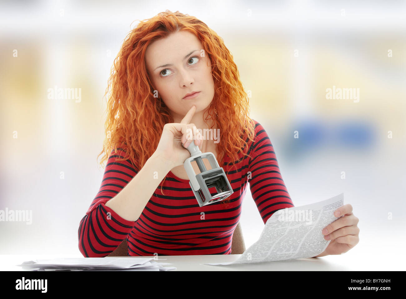 Secretary stamp the document at the desk Stock Photo - Alamy