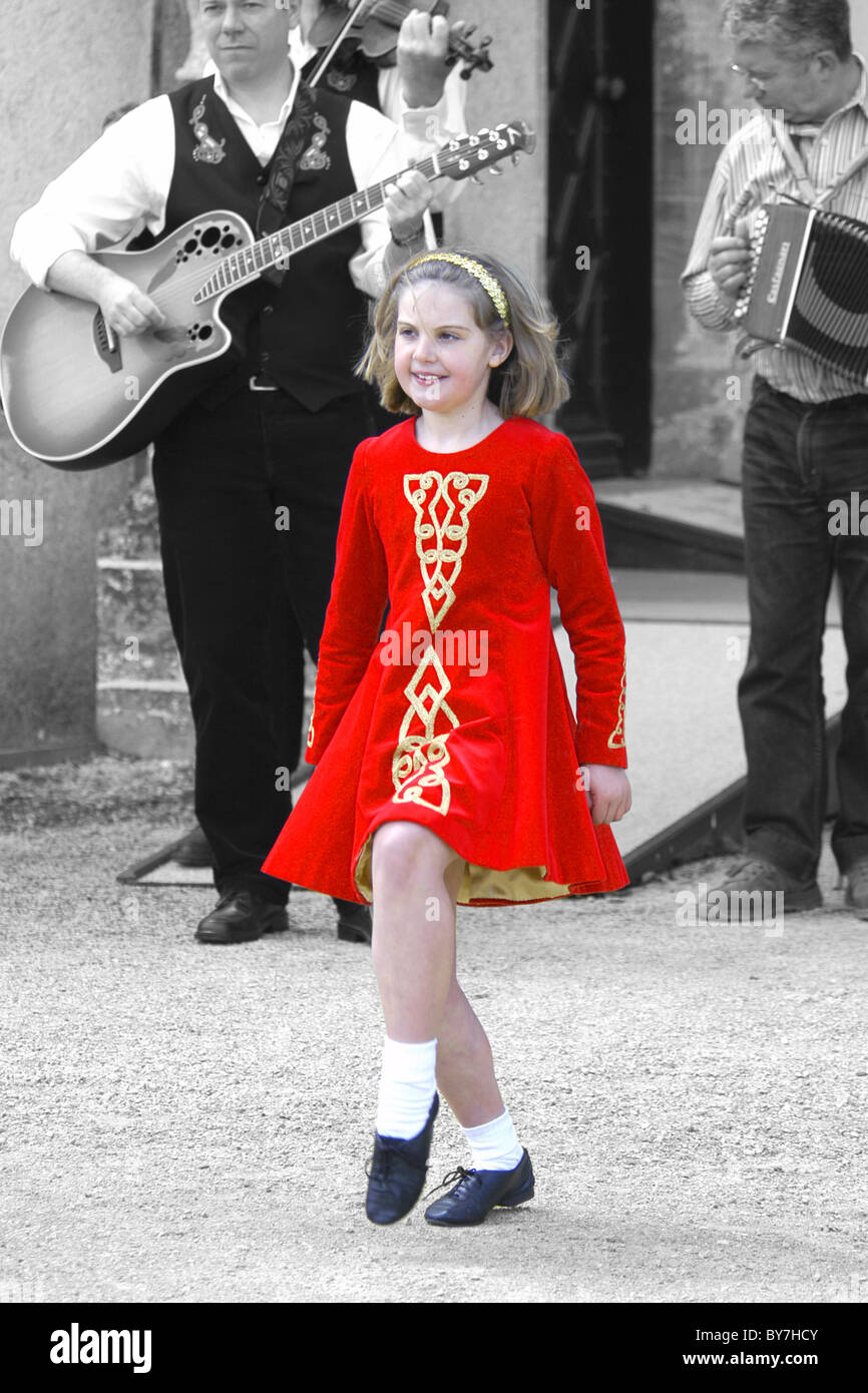 Red Tinted Retro Image of an Irish Teenage Girl dancing a jig Stock ...