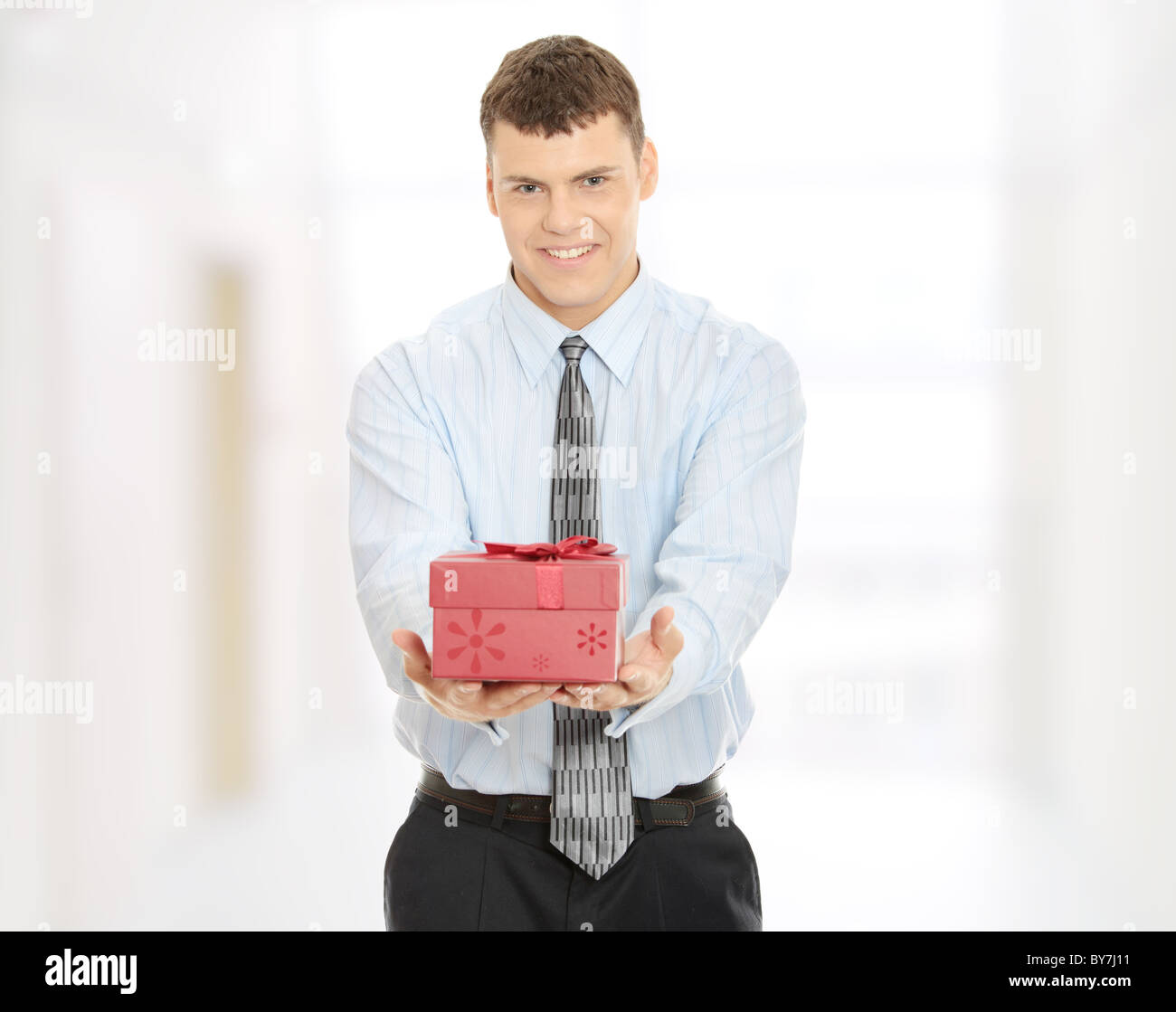 Business man offering a gift Stock Photo - Alamy