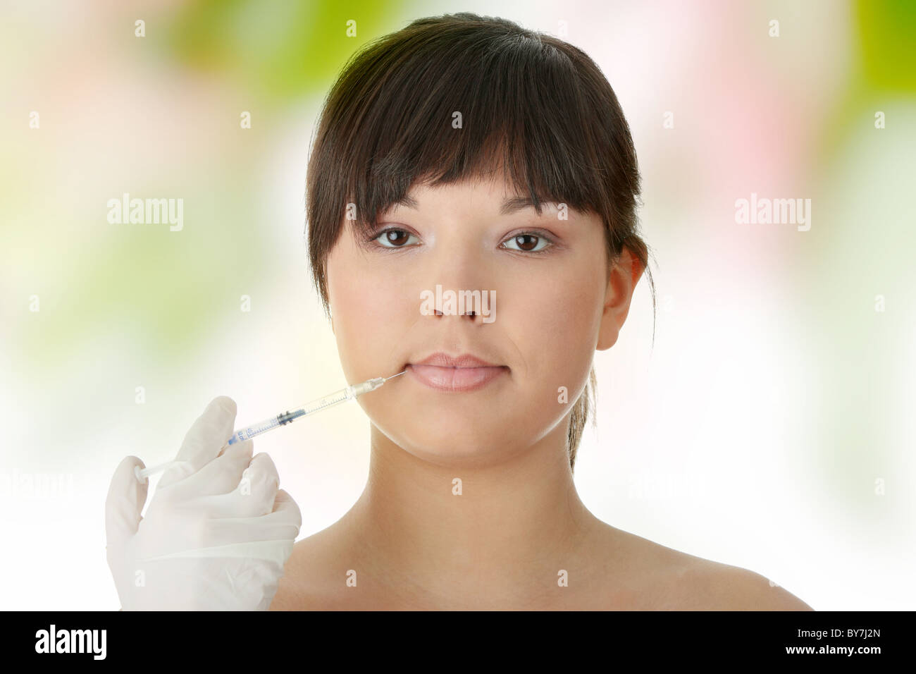Pretty woman getting botox injection hi-res stock photography and ...
