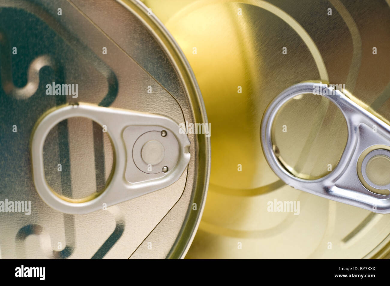 two golden metal cans with keys, macro Stock Photo - Alamy