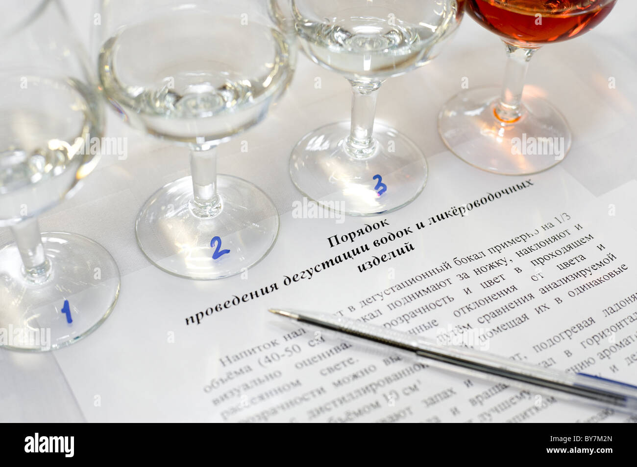 wine sampling - a line of numbered goblets and a memo for tasters Stock ...