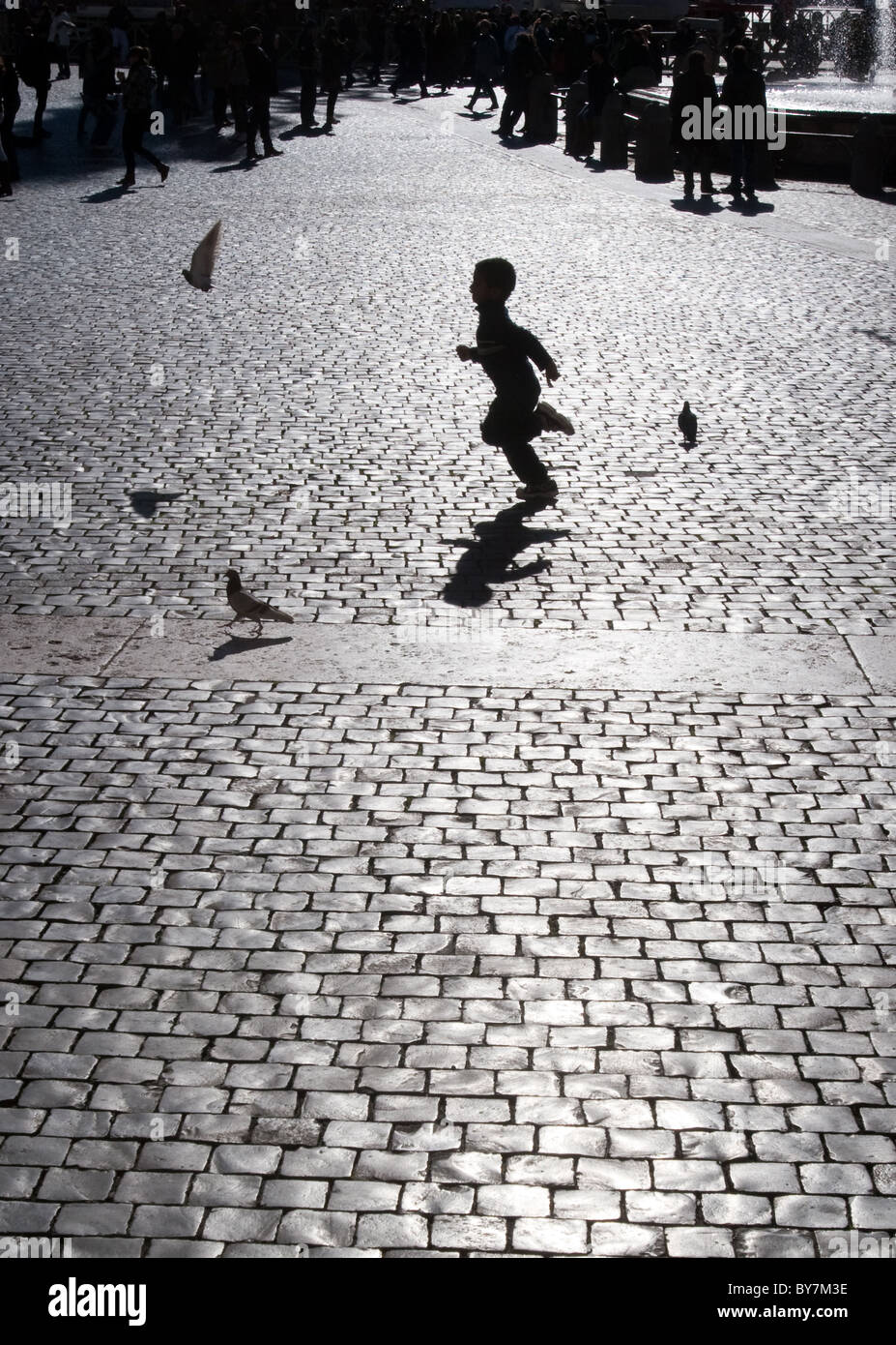 silhouette of child running in Saint Peter's square Vatican city Rome ...