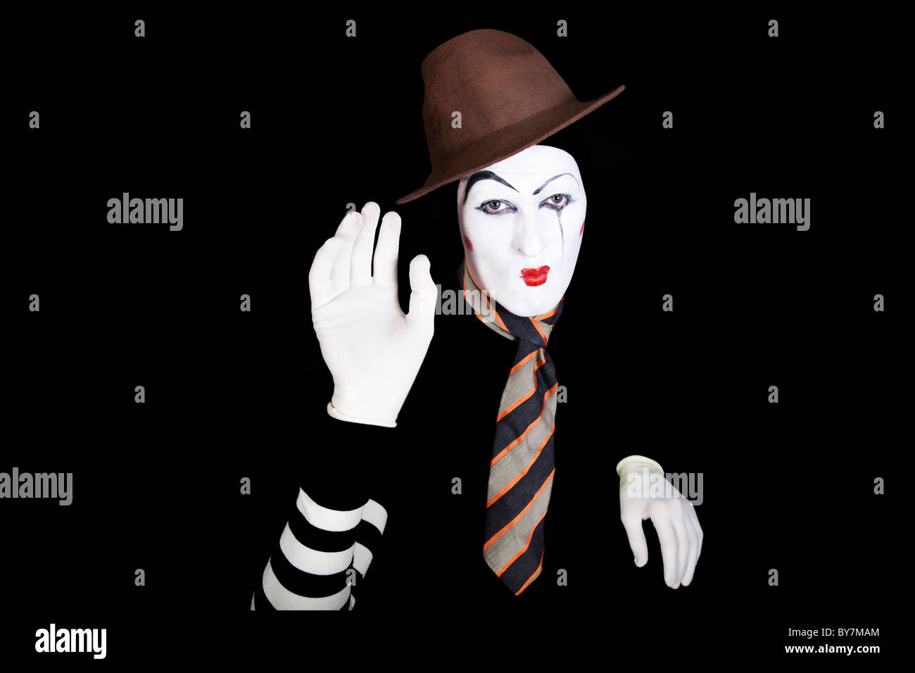 portrait of mim in white gloves on black background Stock Photo - Alamy