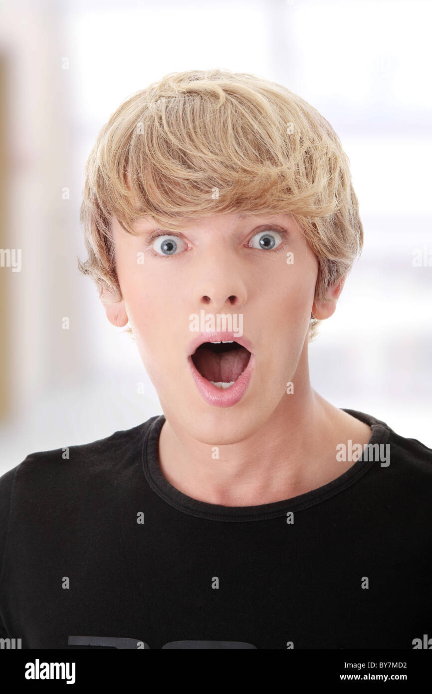 Young man with surprise expression on his face Stock Photo - Alamy