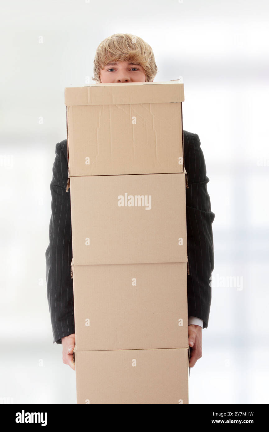 Businessman with stacked Boxes Stock Photo - Alamy
